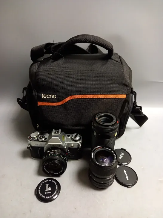 Lot 5020: CANON AE-1 SLR CAMERA WITH 2 SPARE LENSES AND TECNO CAMERA ...