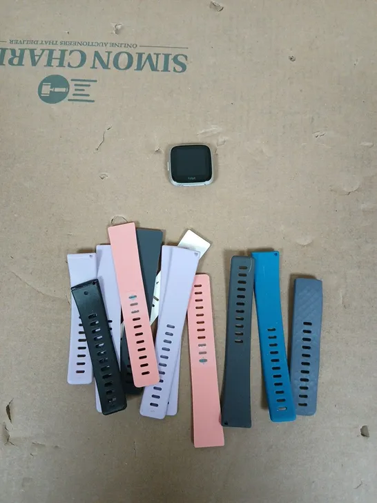 Lot 3209: FITBIT WATCH FACE AND VARIOUS STRAPS IN DIFFERENT COLOURS AND ...