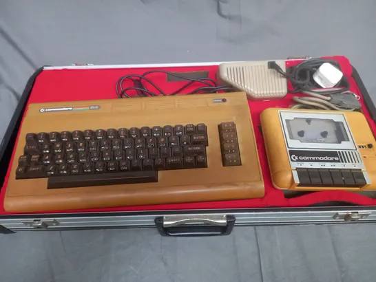 Lot 7711: COMMODORE 64 GAME CONSOLE - 4707642 | Simon Charles Auctioneers