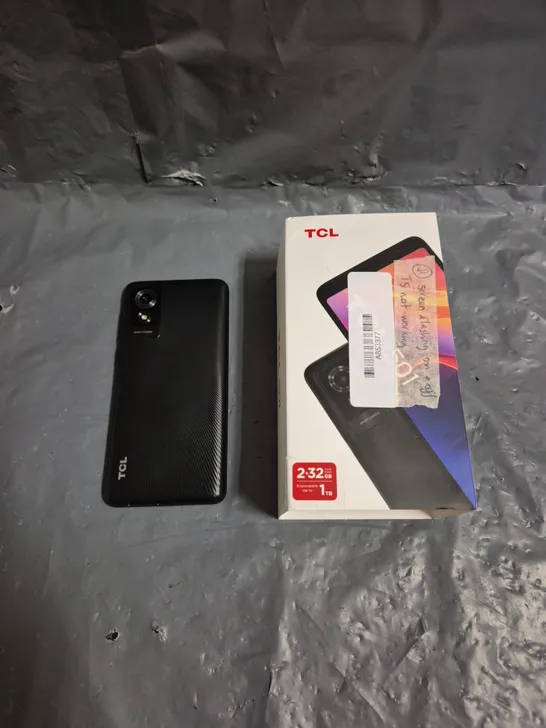 Lot 7033: BOXED TCL 501 SMARTPHONE IN BLACK - 5183423 | Simon Charles ...